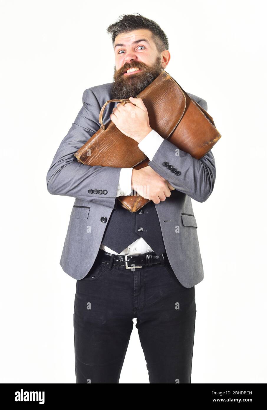 Hipster with greedy face and vintage briefcase. Bearded man wears ...