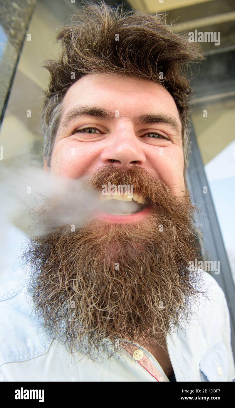 Hipster with tousled hair and gray on relaxed cheerful face with white ...