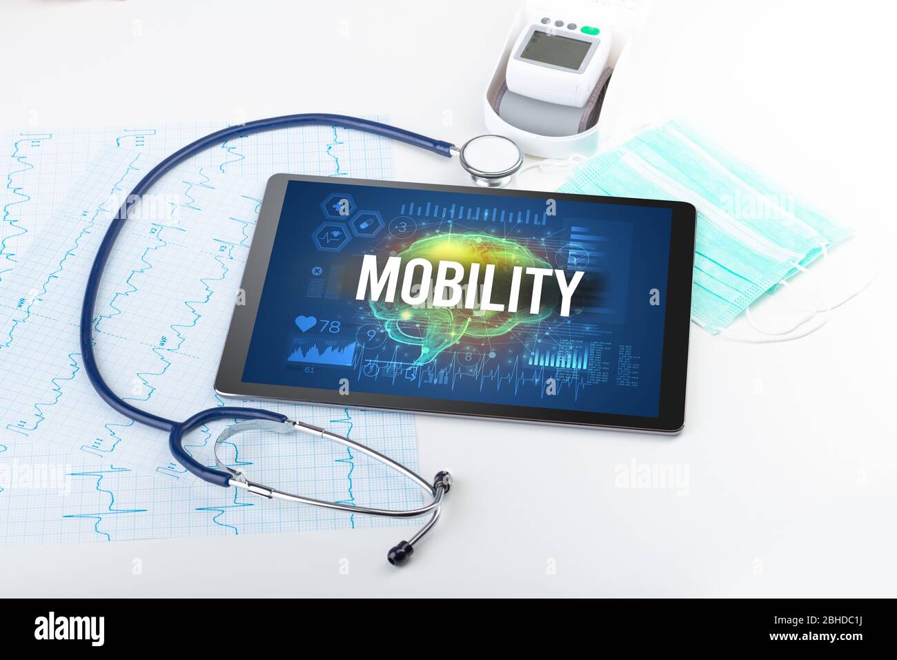 Tablet pc and medical tools with MOBILITY inscription, social ...