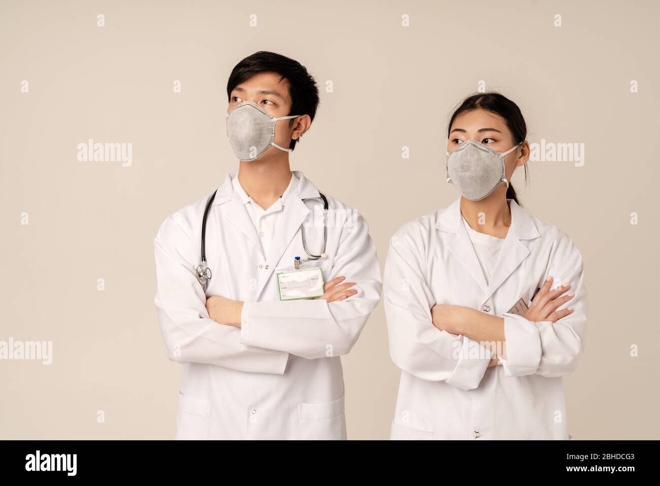 Image of asian young doctors in white uniform and protective masks ...