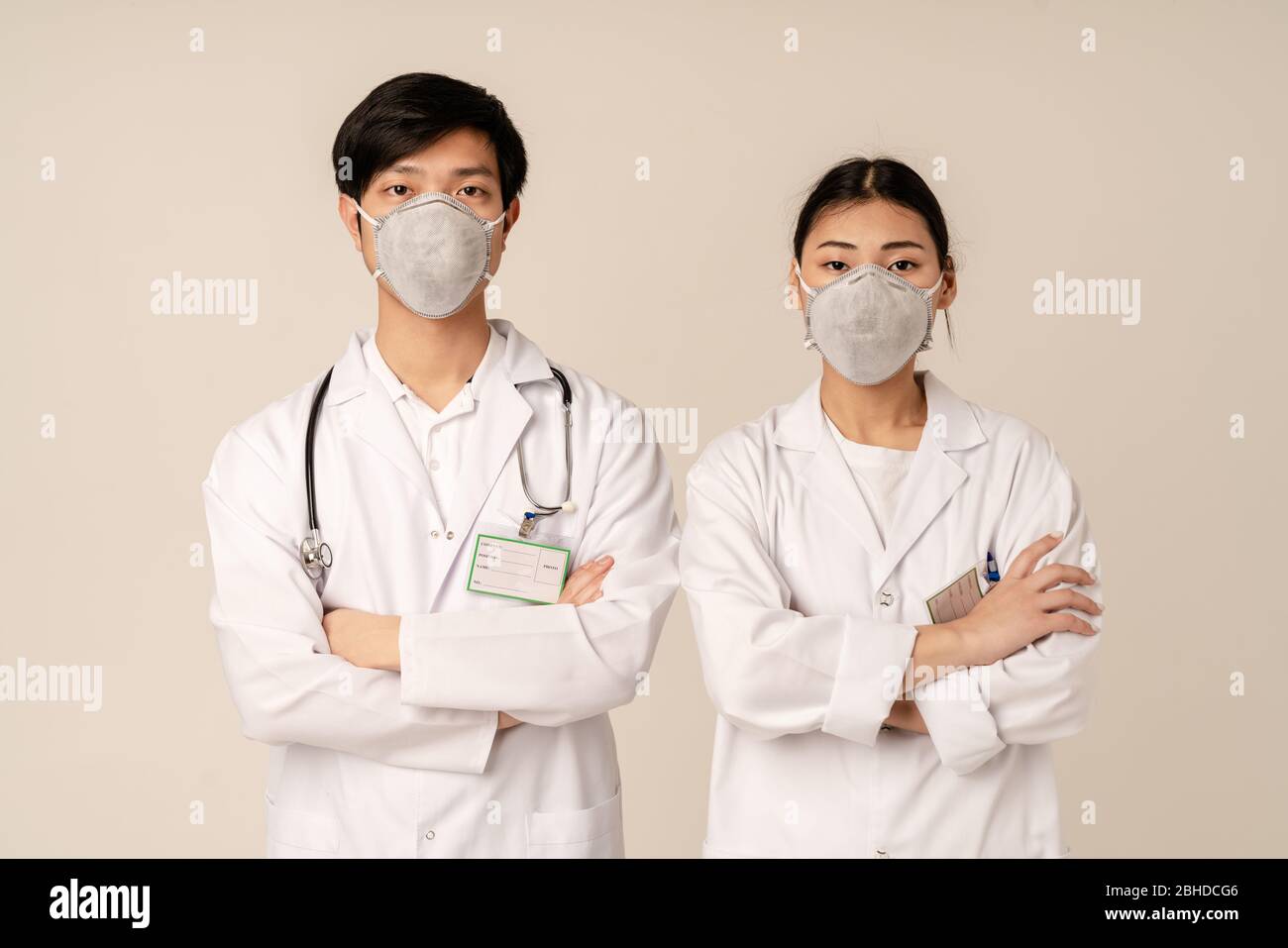 Image of asian young doctors in white uniform and protective masks ...