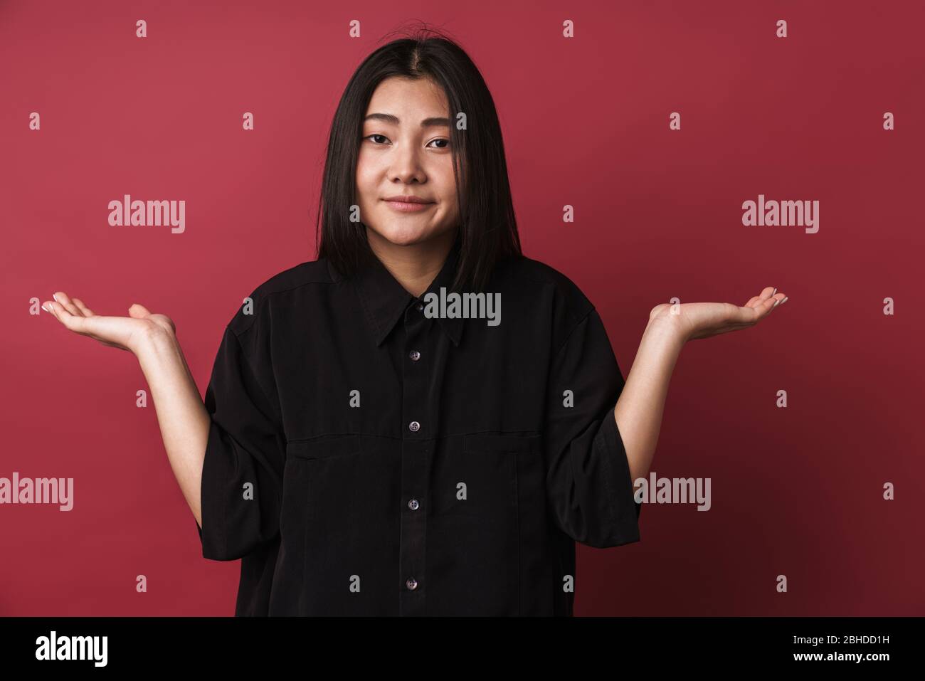 Image of a beautiful positive optimistic asian young woman posing ...
