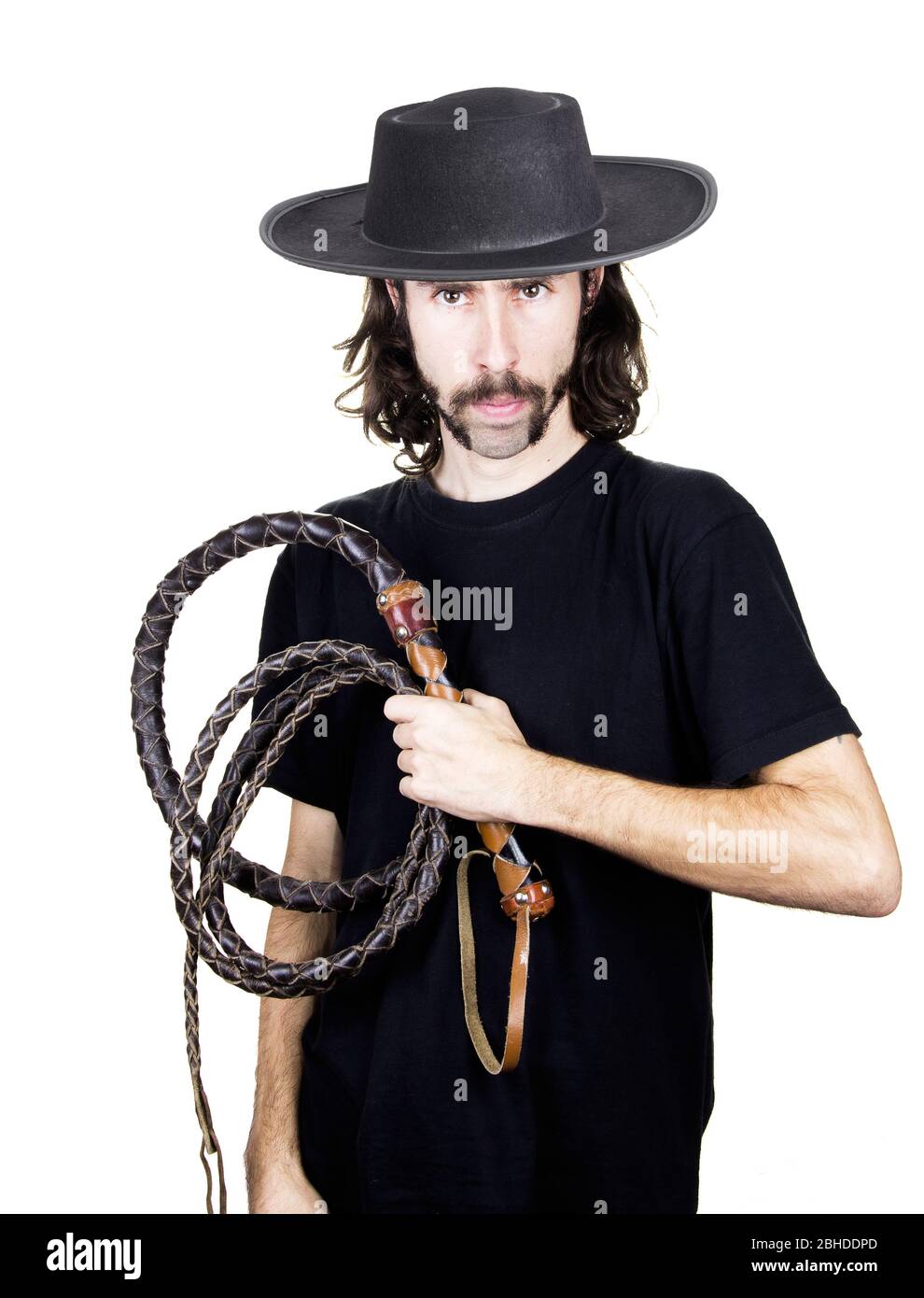 a men with whip and hat Stock Photo - Alamy