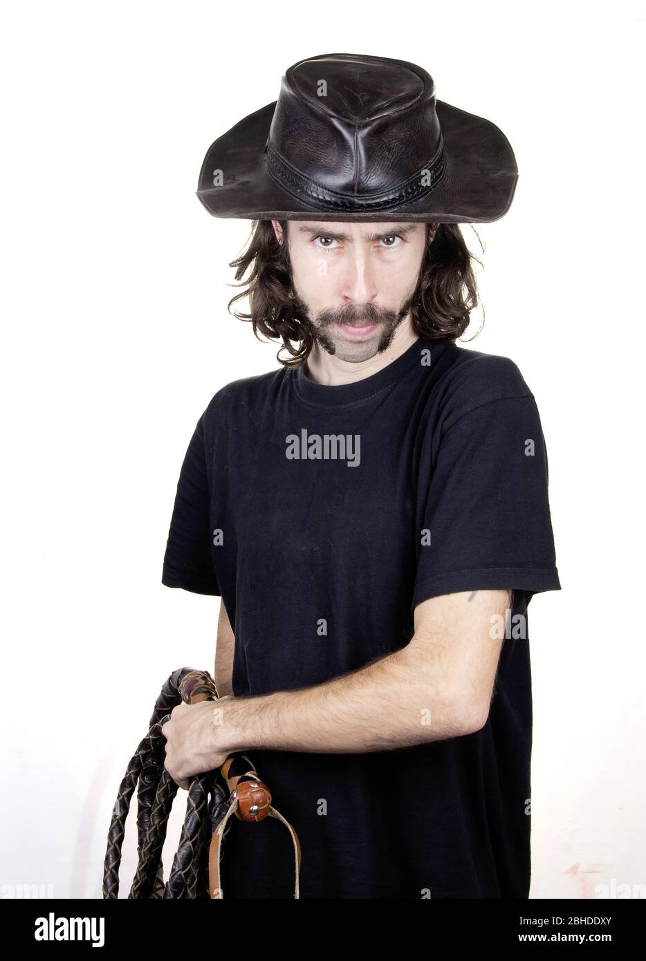 a men with whip and hat Stock Photo - Alamy