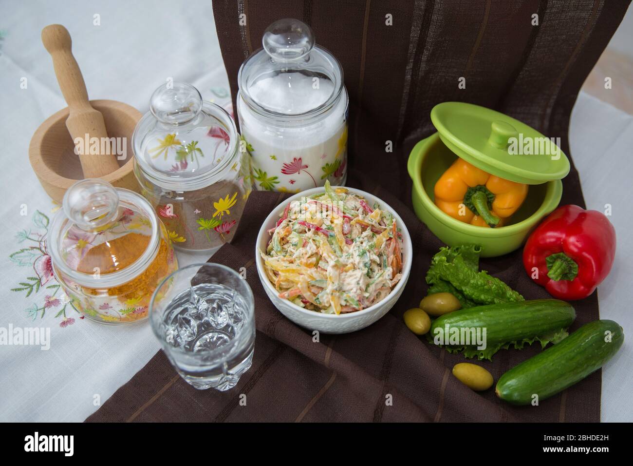 Decorated with lettuce, side view, selective focus . Orange pepper in a ...
