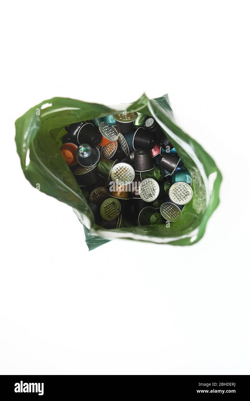 A Nespresso recycling bag in use with used coffee capsule pods on a ...