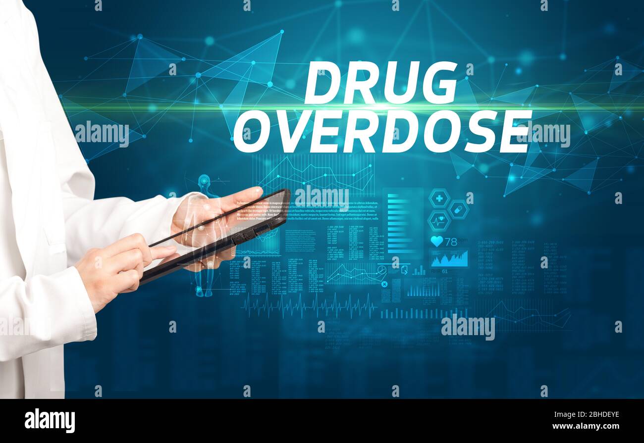 doctor writes notes on the clipboard with DRUG OVERDOSE inscription ...