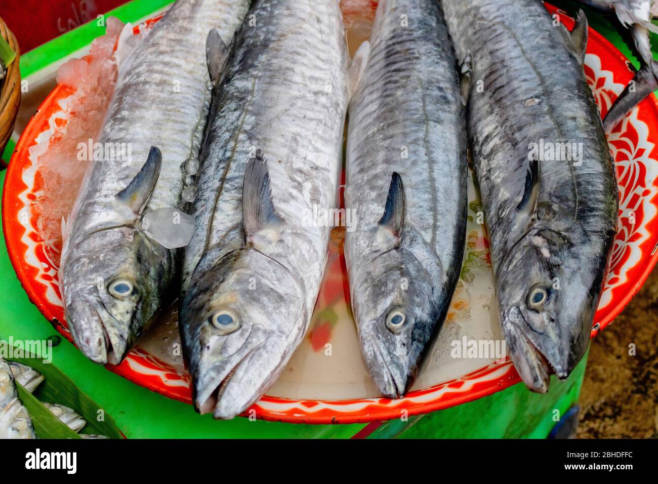 The fresh fish shop on the street with its vendor showing original Thai ...