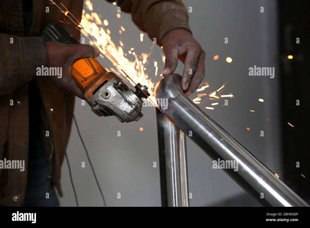 Electric wheel grinding on steel structure in Construction Area Stock ...