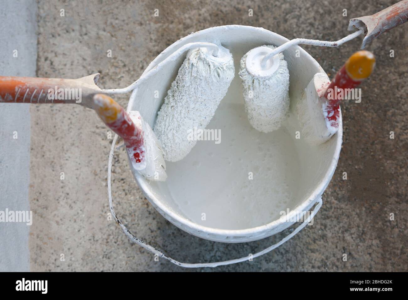 Paint bucket with paint brushes and roller inside the bucket Stock ...