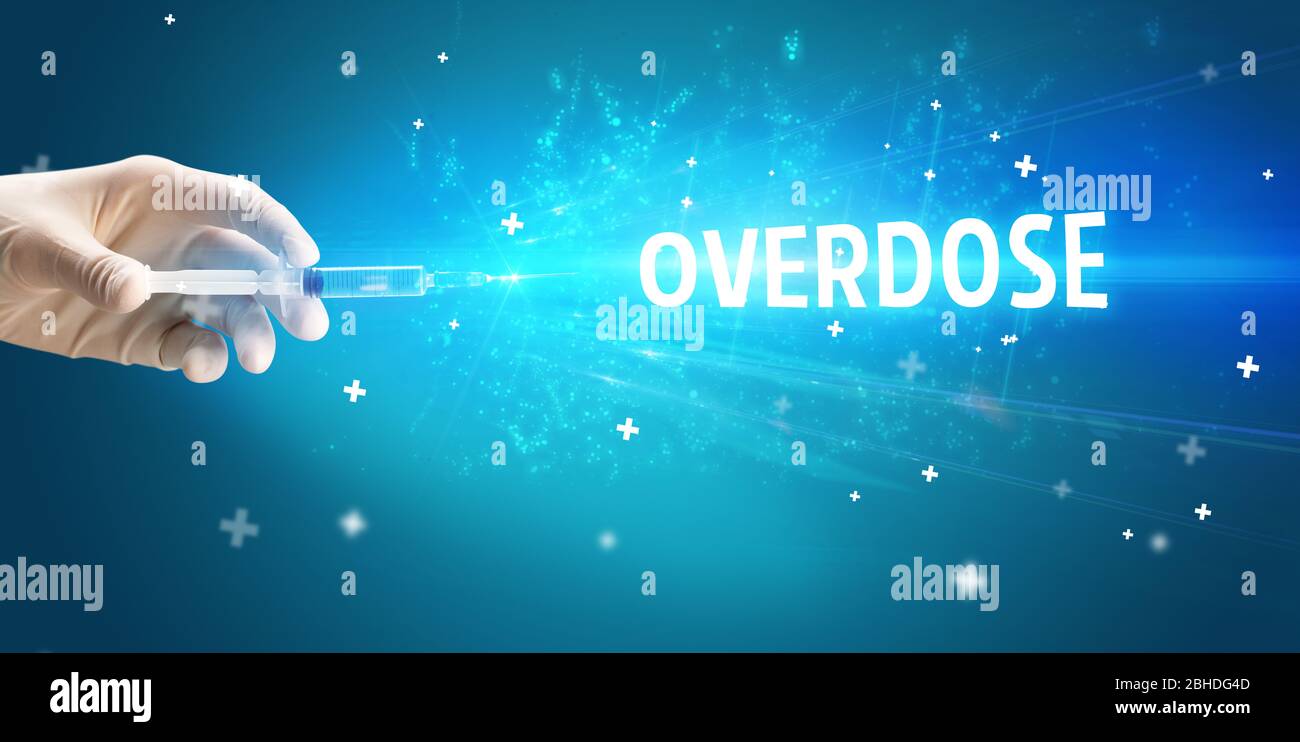 Syringe, medical injection in hand with OVERDOSE inscription, medical ...