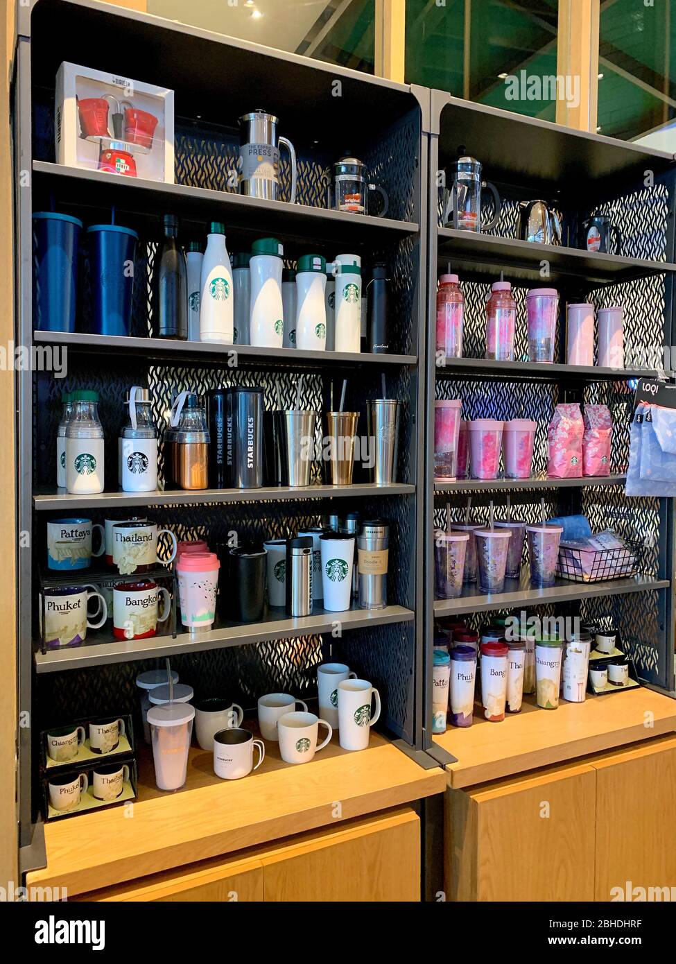 The Modern styles of Starbuck mugs lined up in shelves for customer in ...