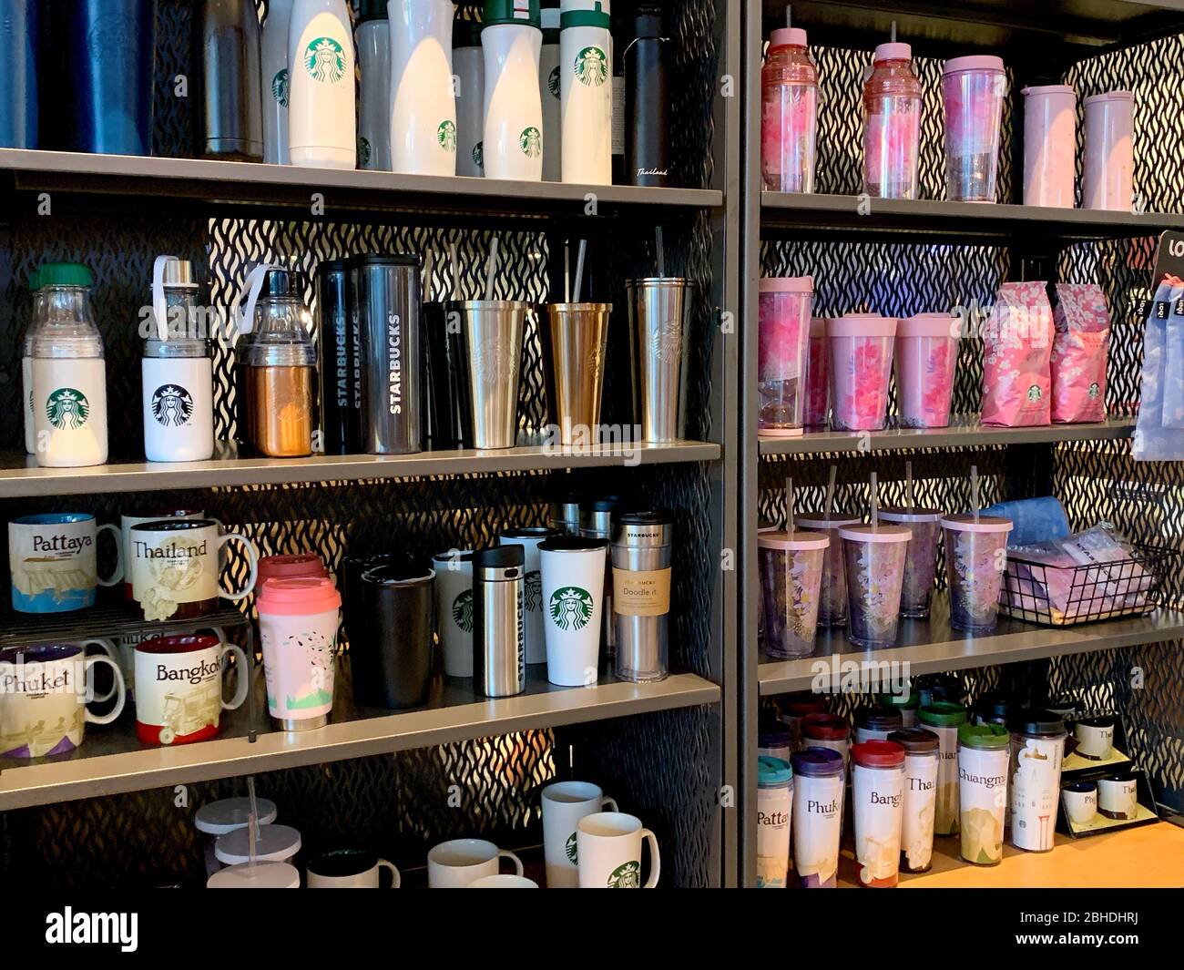 The Modern styles of Starbuck mugs lined up in shelves for customer in ...