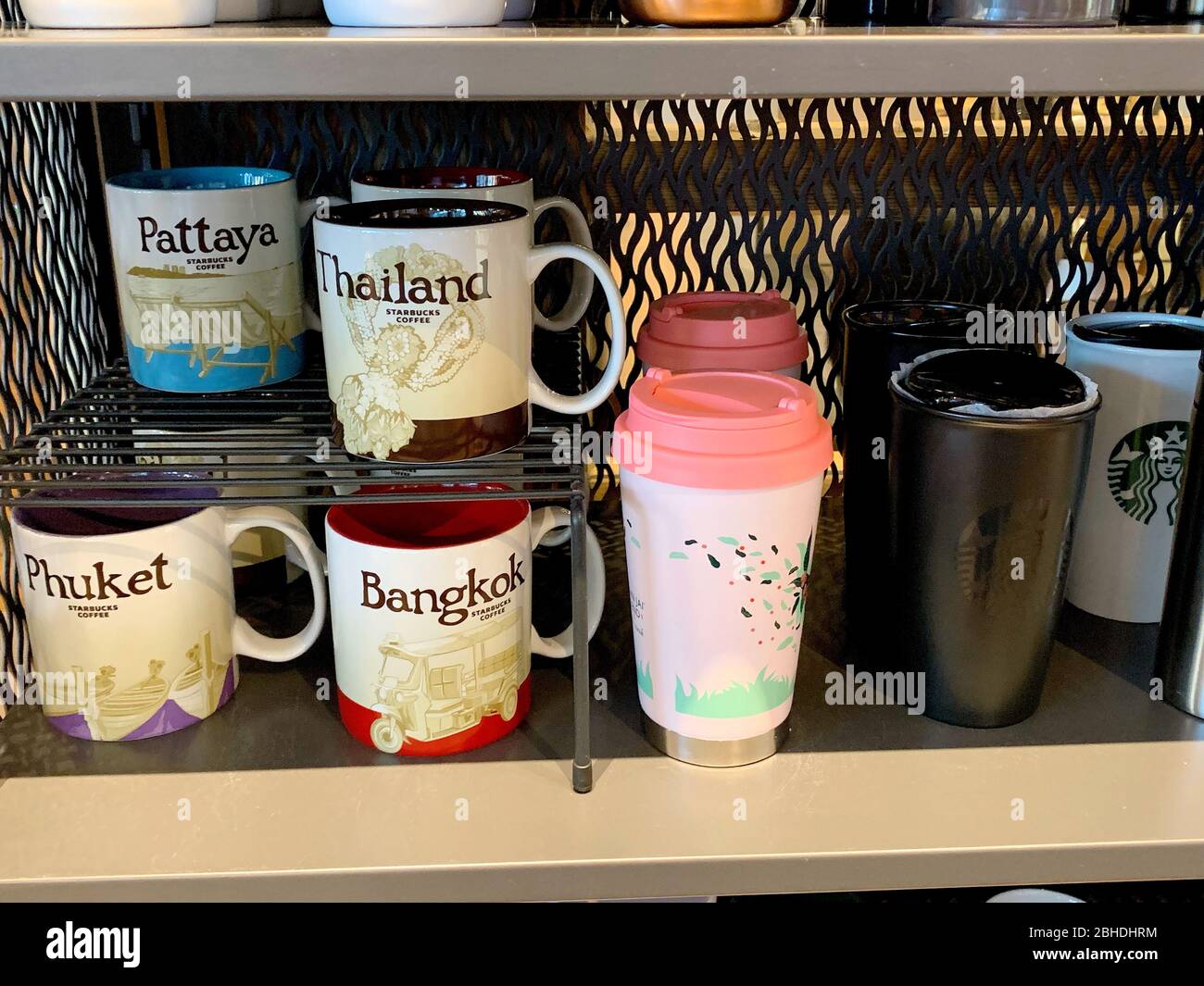 The Modern styles of Starbuck mugs lined up in shelves for customer in ...