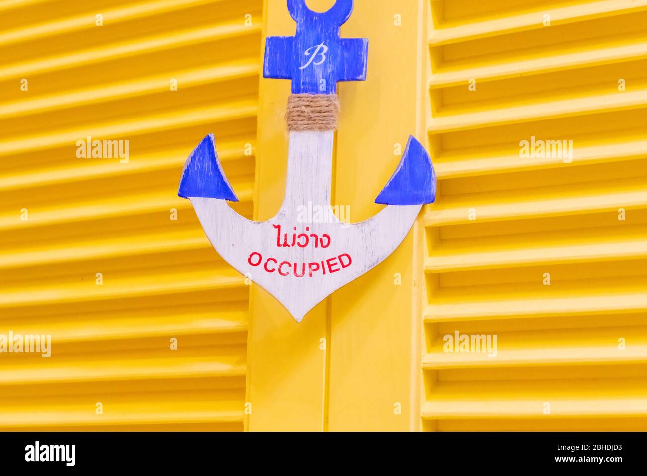 Mini anchor which is made to be an occupied sign on it with English and ...