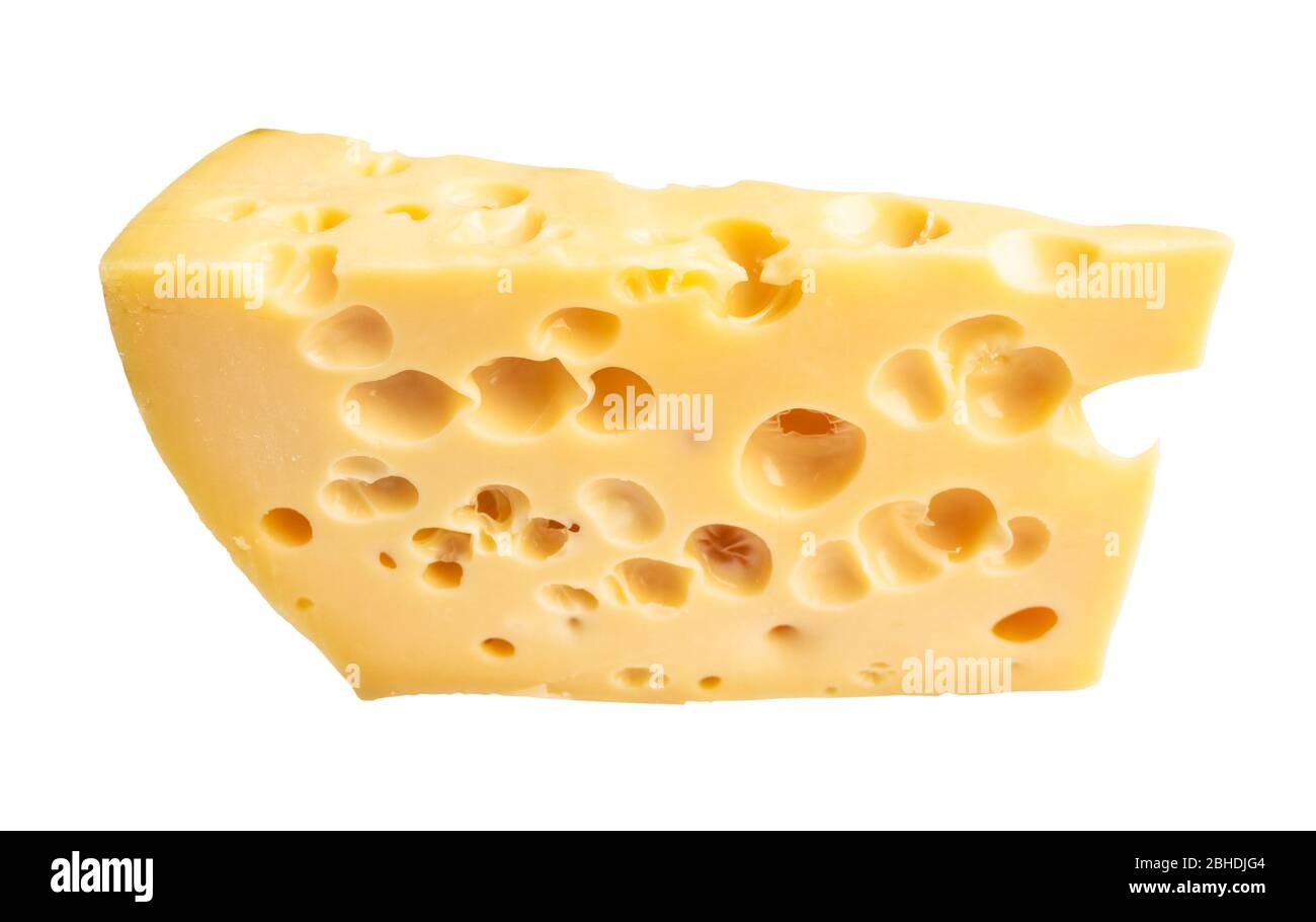 triangular piece of yellow cow's milk swiss cheese with holes cutout on ...