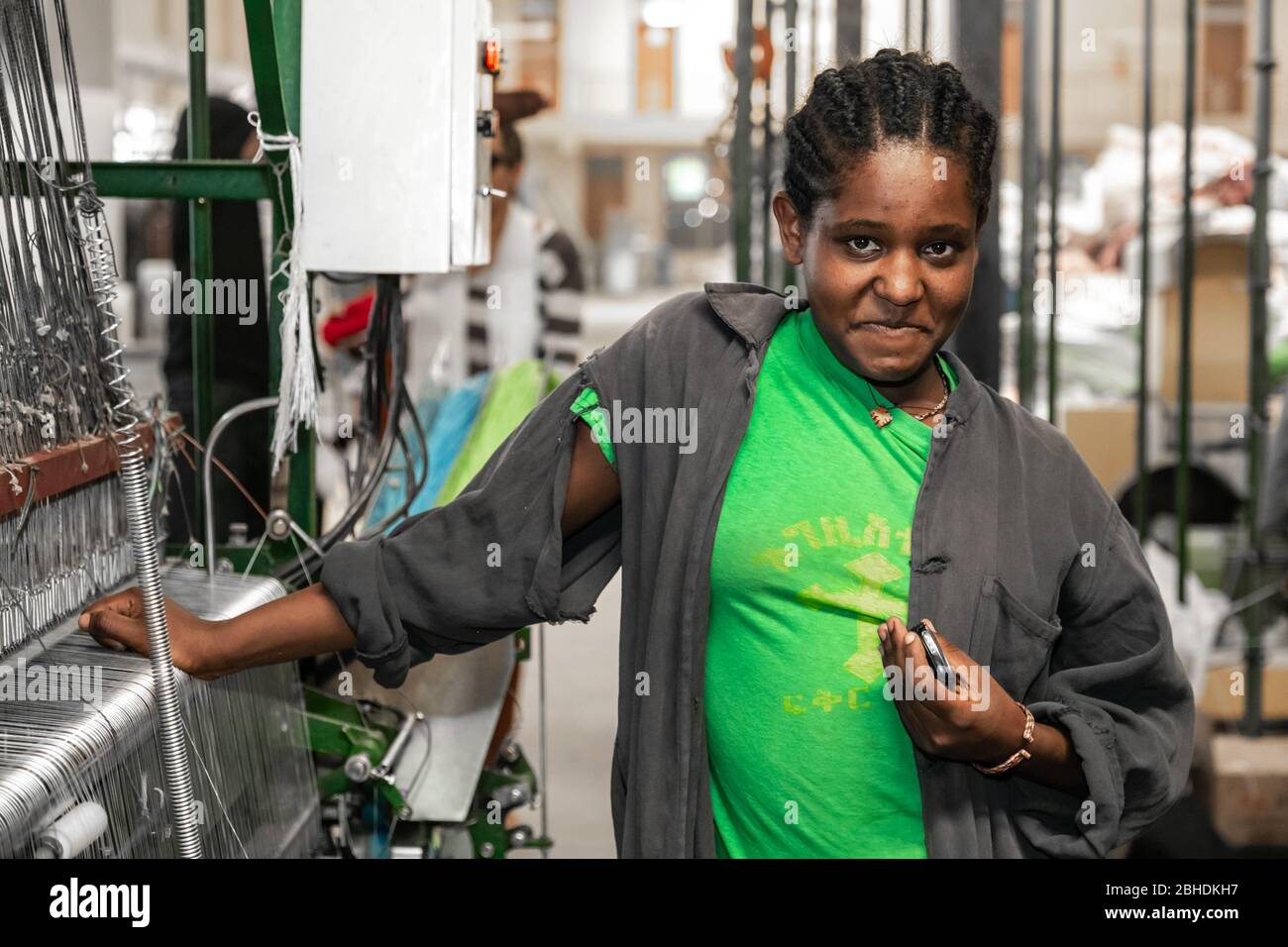 Addis Ababa, Ethiopia - January 30, 2014: Young female worker Inside a ...