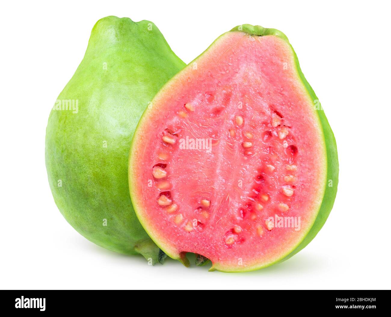Isolated green guava. One whole guava fruit and a pink fleshed half ...