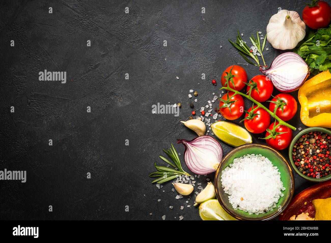 Food cooking background on black table Stock Photo - Alamy