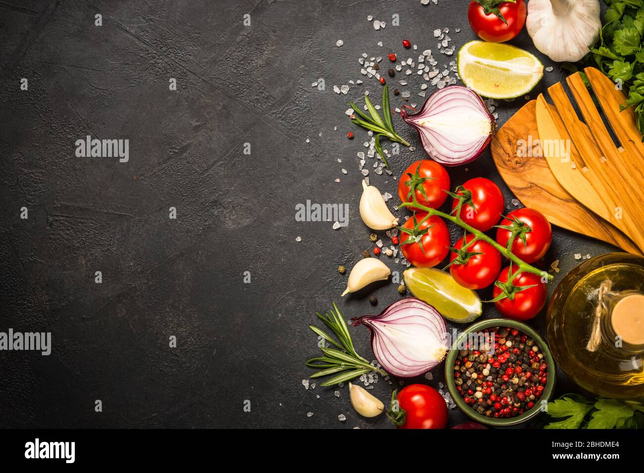 Food cooking background on black table Stock Photo - Alamy