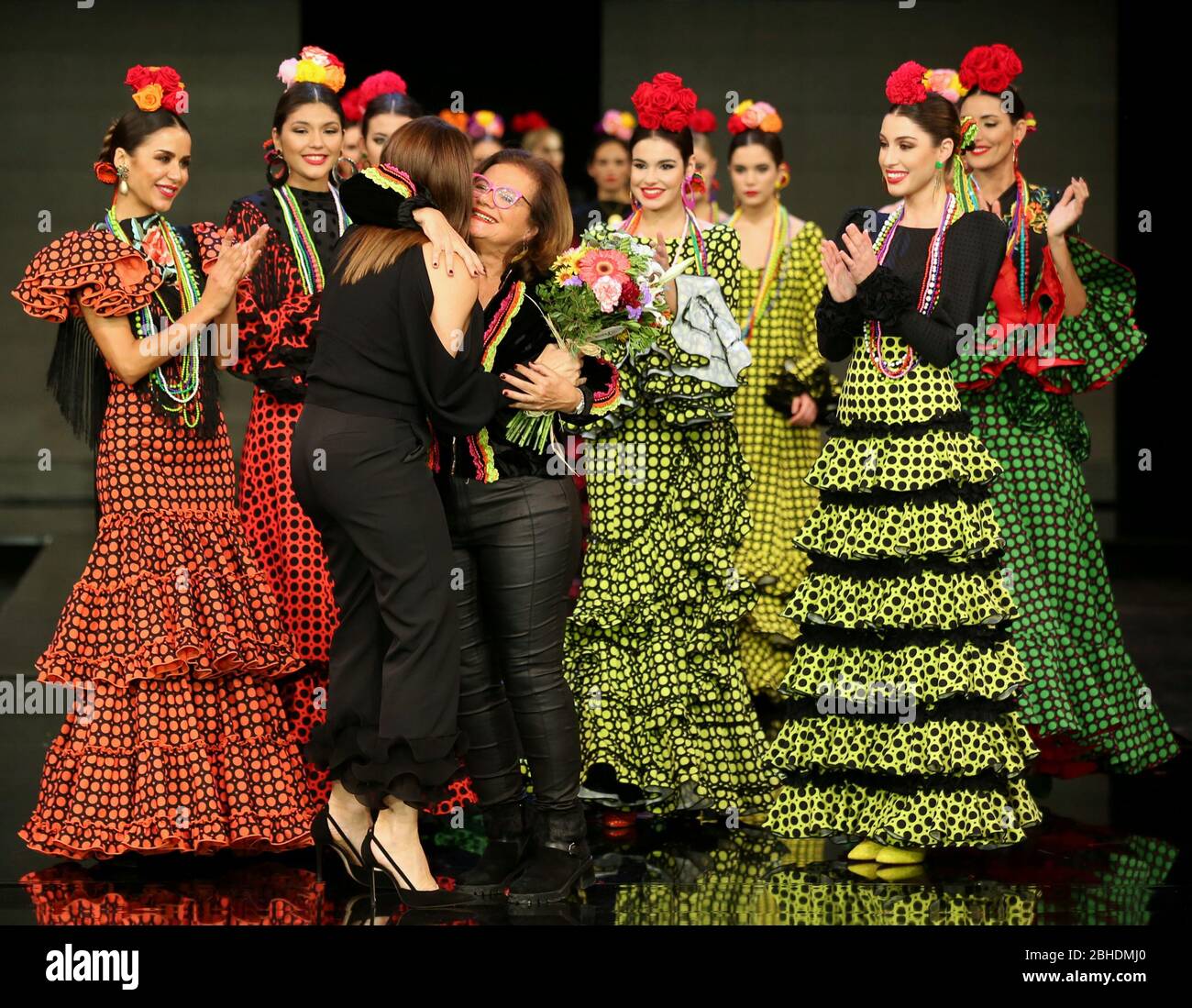 SEVILLA, SPAIN - JAN 30: Designer Pilar Vera and her models at the end ...