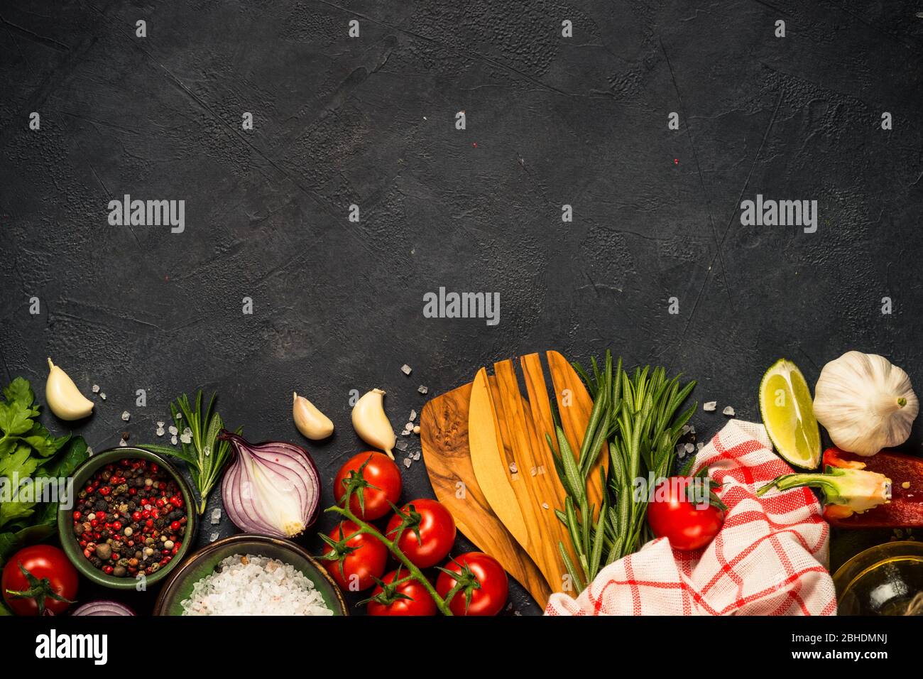 Food cooking background on black table Stock Photo - Alamy
