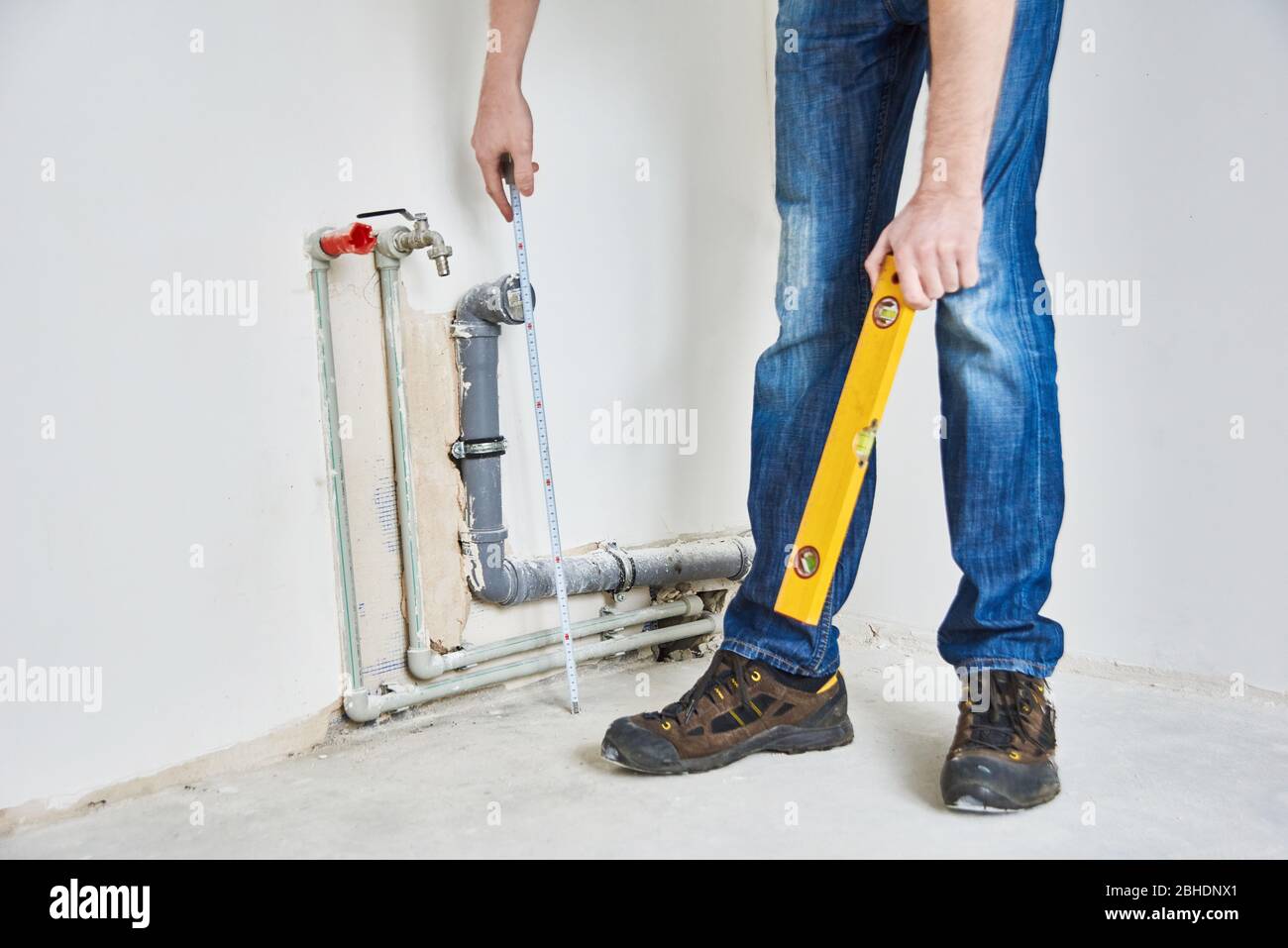 Plumbing in the house. Installation of sewer pipes in the kitchen of an ...