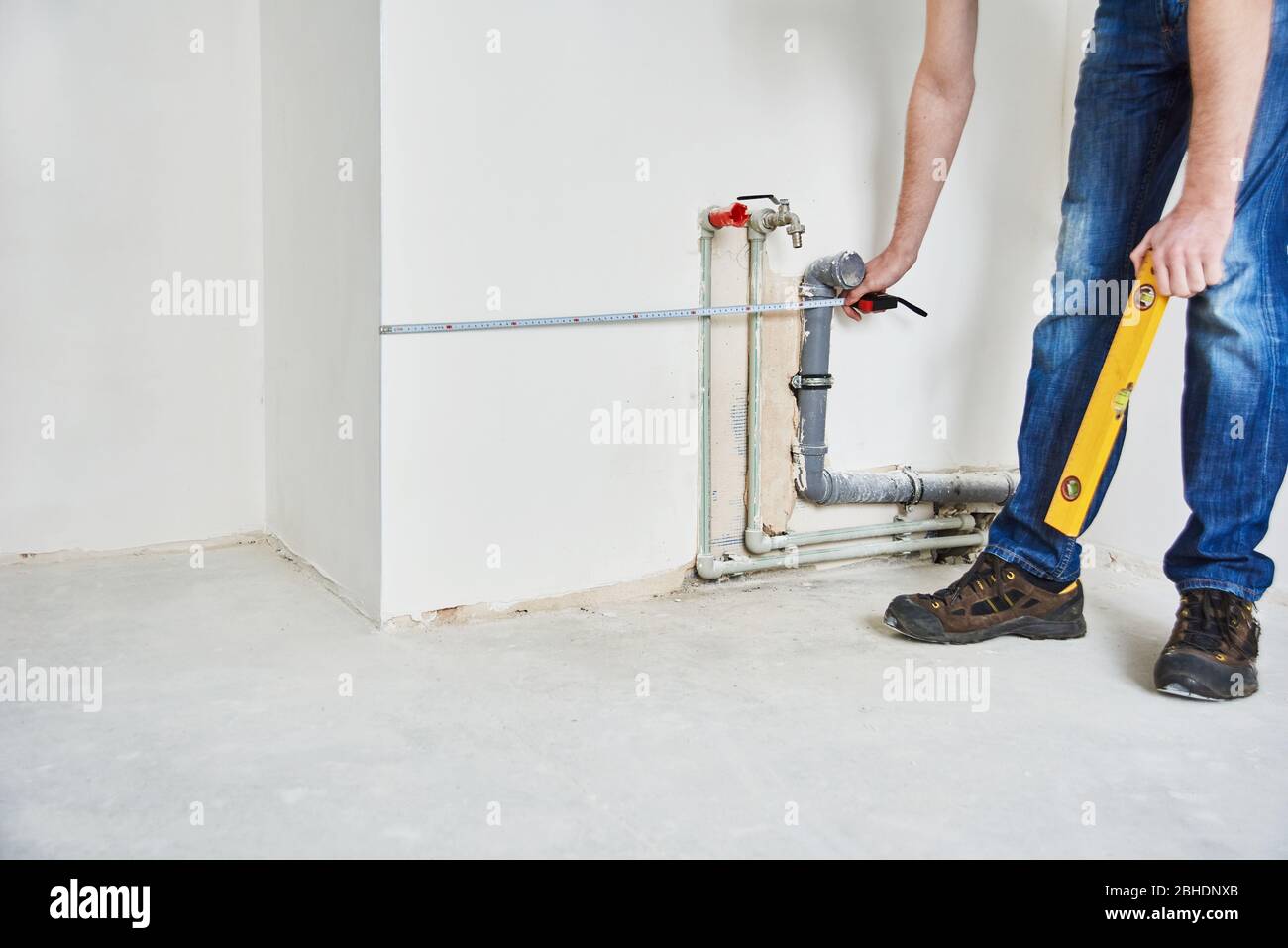 Plumbing in the house. Installation of sewer pipes in the kitchen of an ...