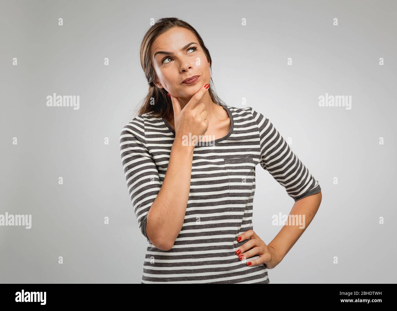 Portrait of a beautiful woman with a thinking expression Stock Photo ...