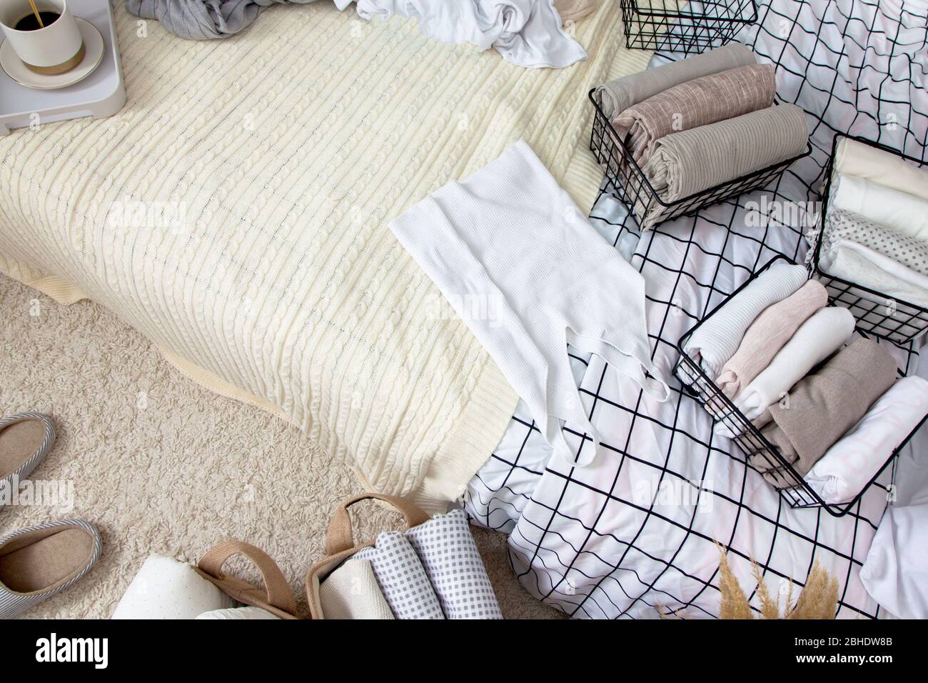 Top view of beautifully folded things in container Stock Photo - Alamy