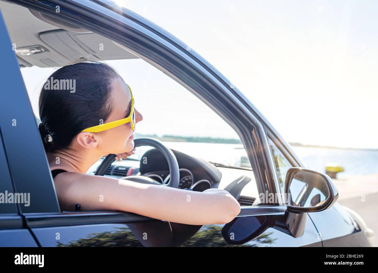 Woman driver driving a car Stock Photo - Alamy