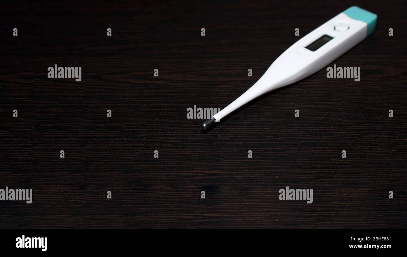 Digital Thermometer on black background to check body temperature Stock ...