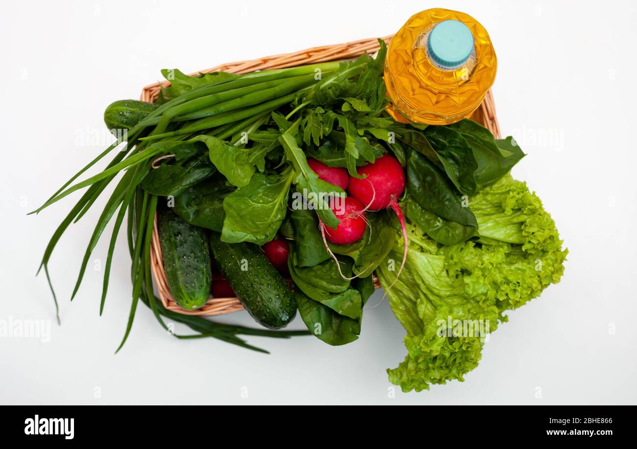 Delivery of products. Box with vegetables and sunflower oil. A set of ...