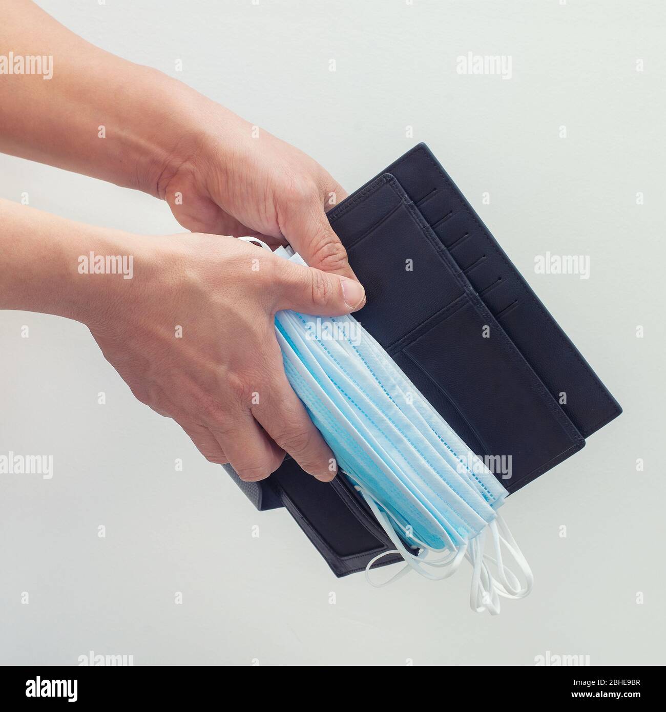 Person holding a wallet hi-res stock photography and images - Alamy