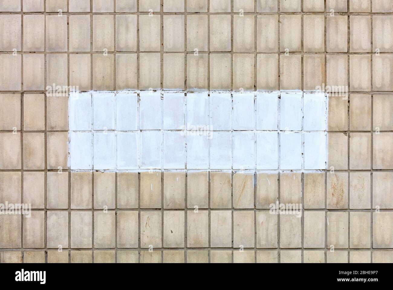 The old wall is covered with old rectangular tiles, and the selected ...