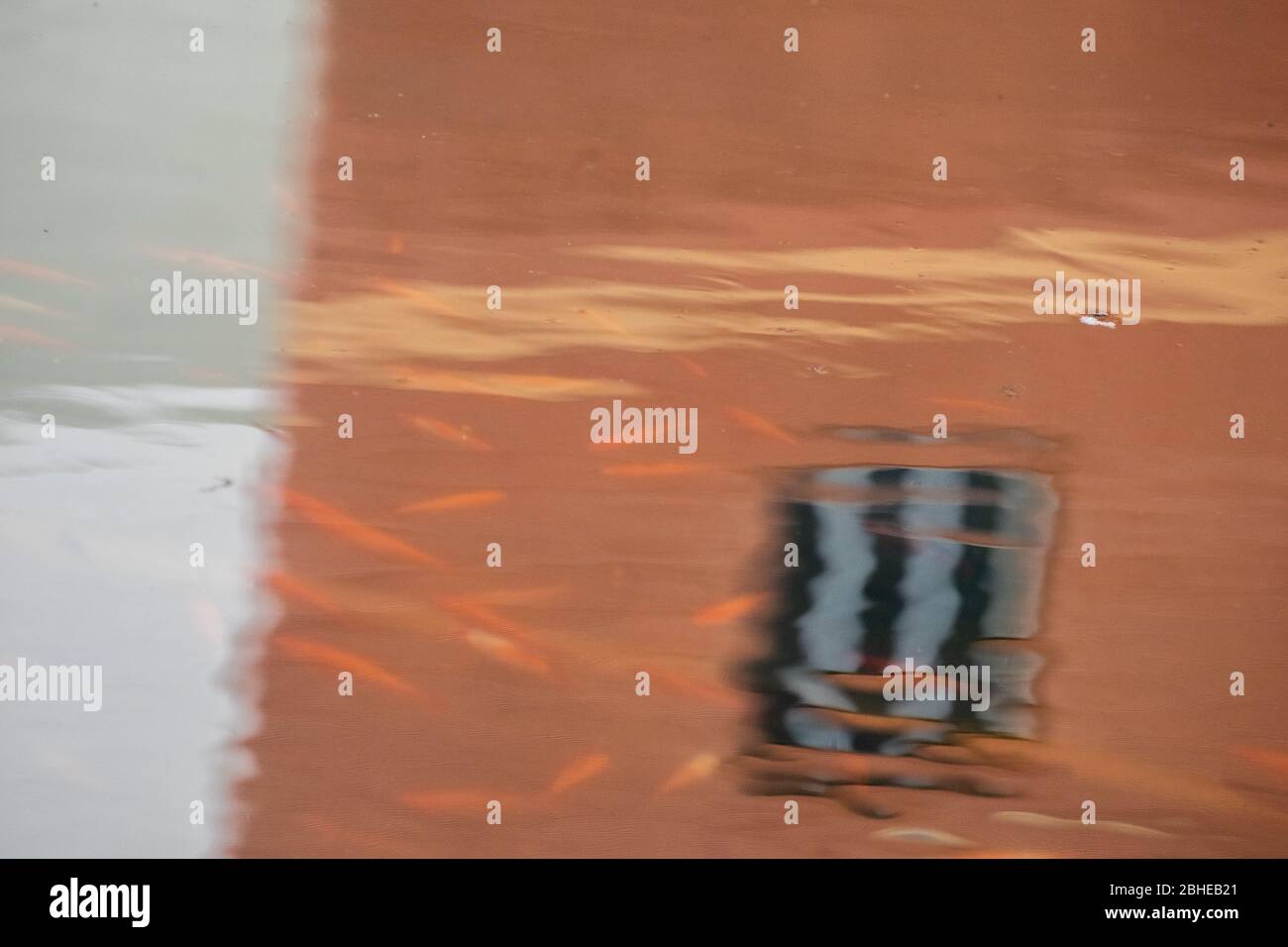 wall and window reflected on the water Stock Photo - Alamy