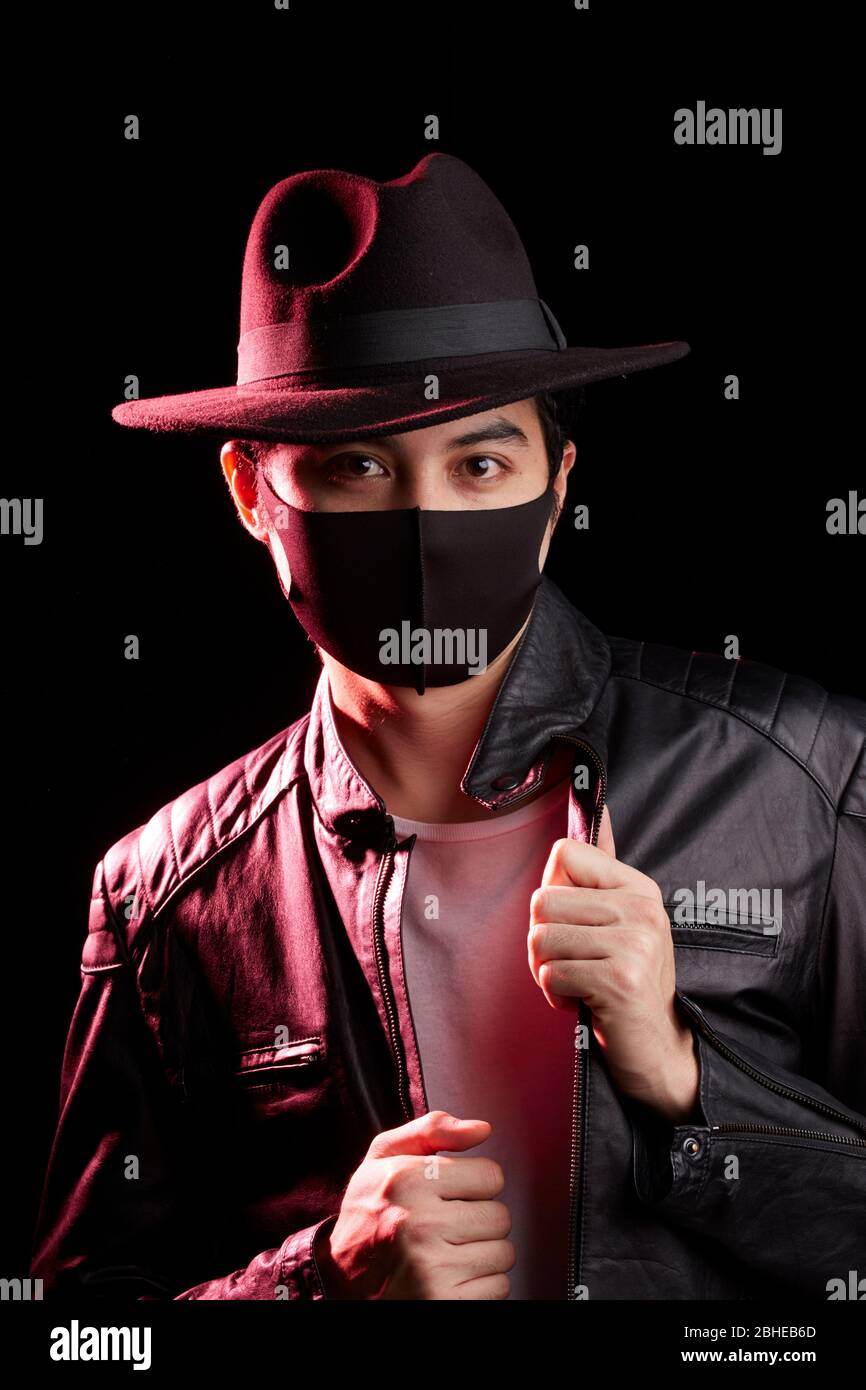 man in black face mask Stock Photo - Alamy