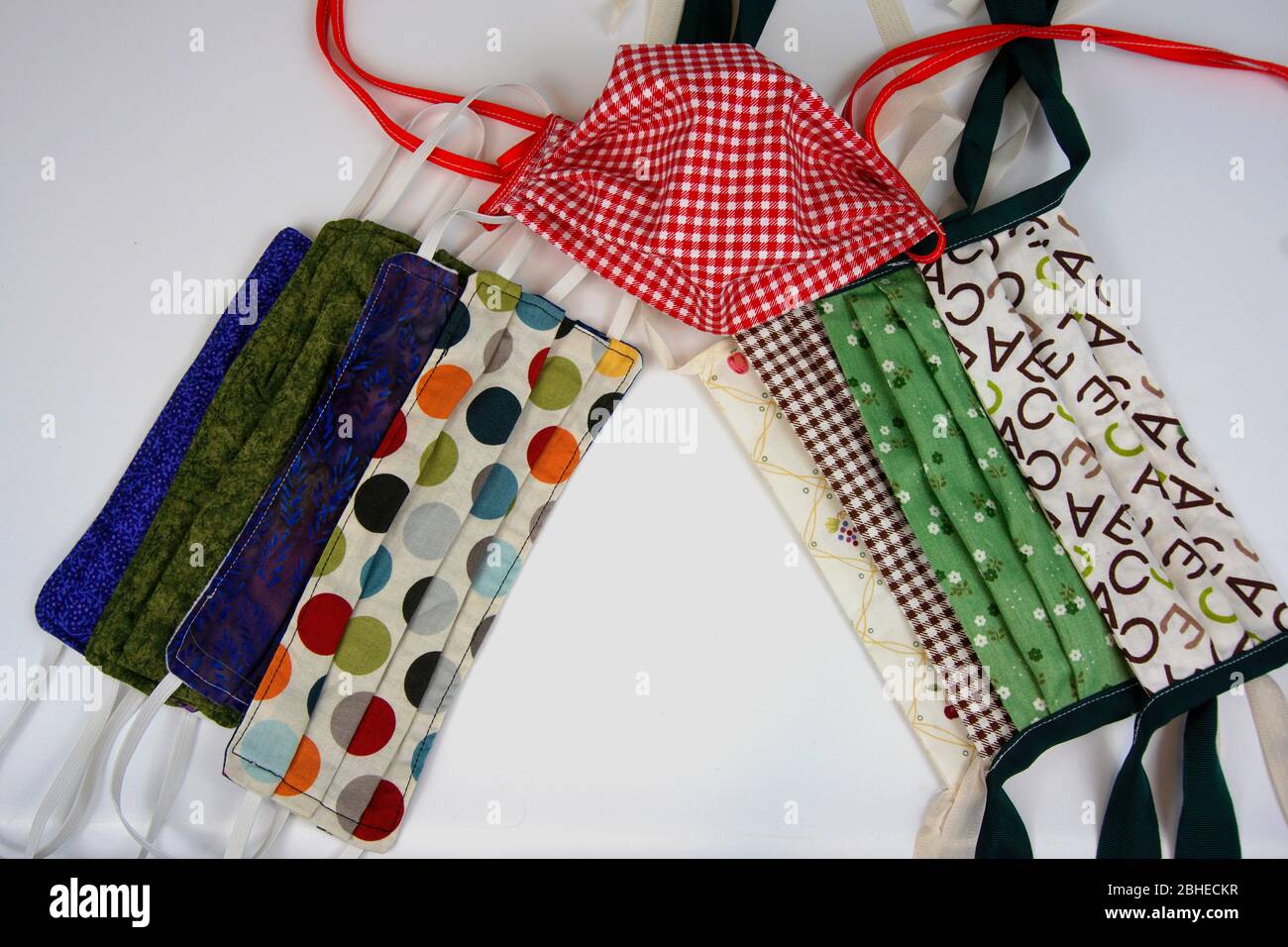 Various styles of homemade multicolored cloth face masks Stock Photo ...