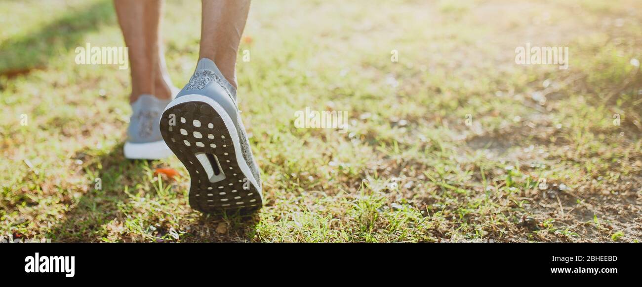 Running man feet ready for run at public park. Healthy lifestyle and ...