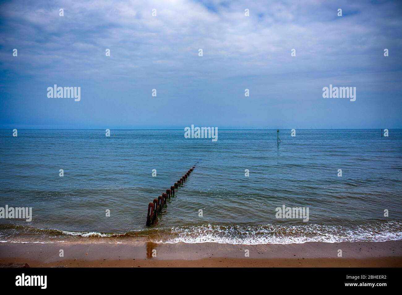 Breakwater with marker in North Wales UK Stock Photo - Alamy