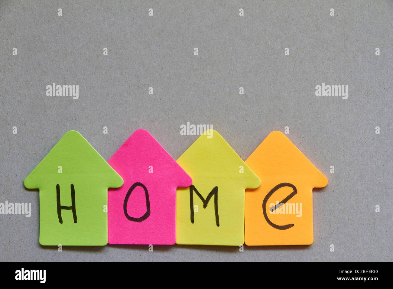 Word Home close-up made up of colorful paper houses with letters. Stay ...