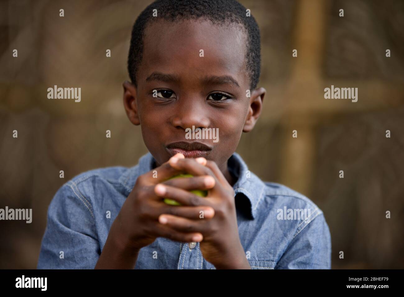 African American Boy Eating An Apple High Resolution Stock Photography ...