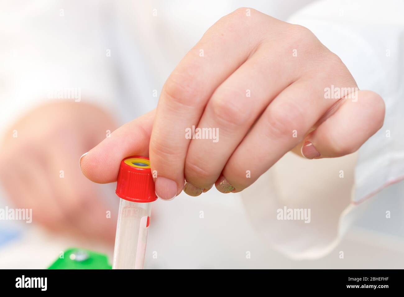Doctor hand is taking test tube from tray on the table, close-up Stock ...
