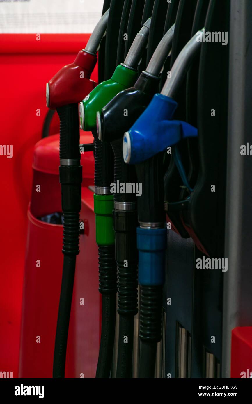 Nozzle for fuel supply at a service station, each nozzle a different ...