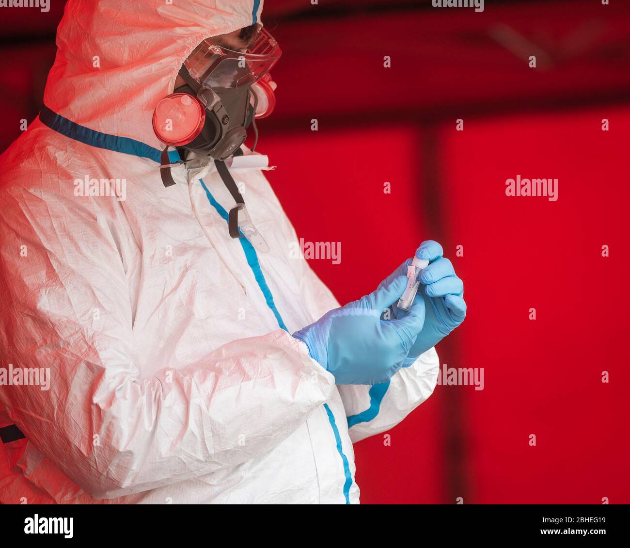 Medical staff with face mask and professional uniform sticks sample ...