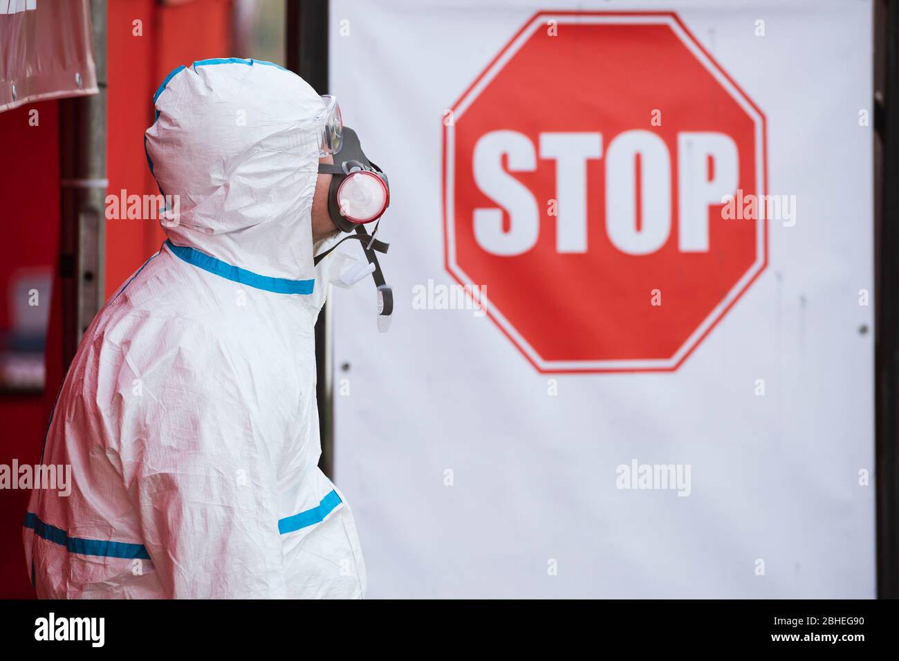 Employee of the medical laboratory and inscription "STOP" at the point ...