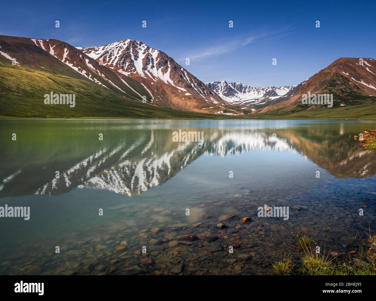 Altai Mountains reflected in the mountain lake, Khoton Lake, Bayan ...