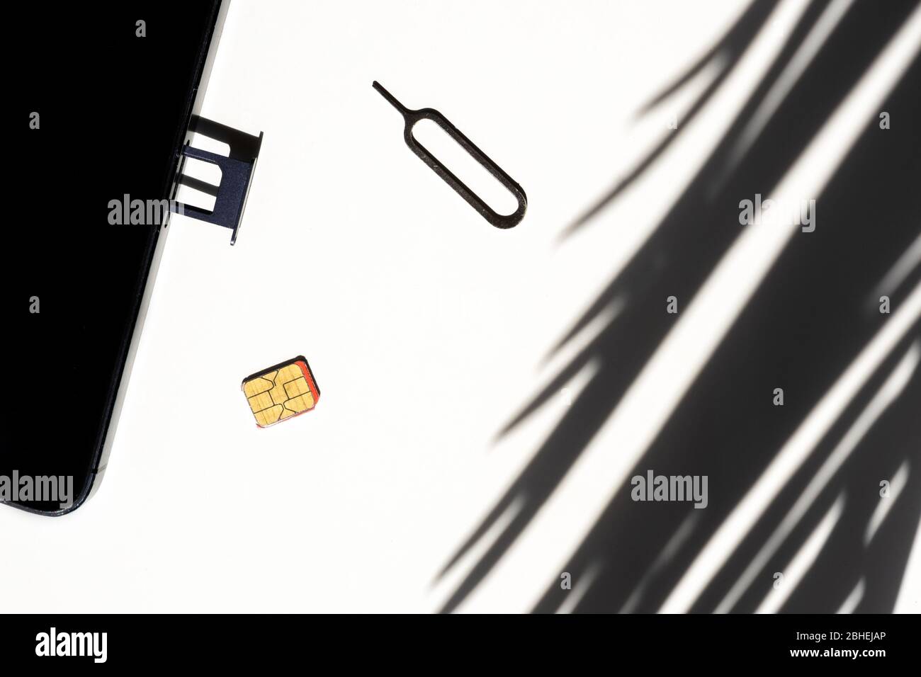 SIM Card, Phone and slot on the white background with Shadow of ...
