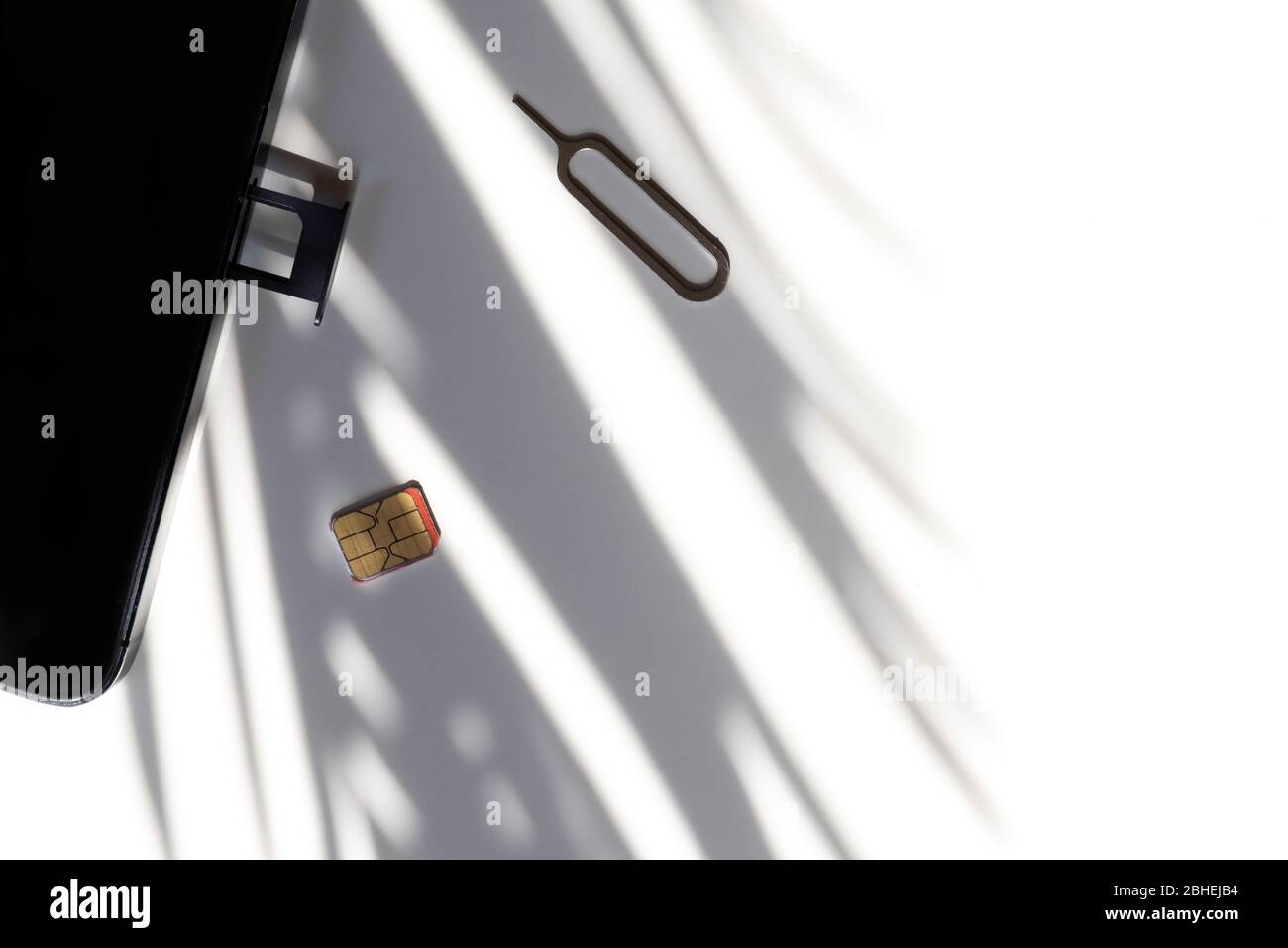 SIM Card, Phone and slot on the white background with Shadow of ...