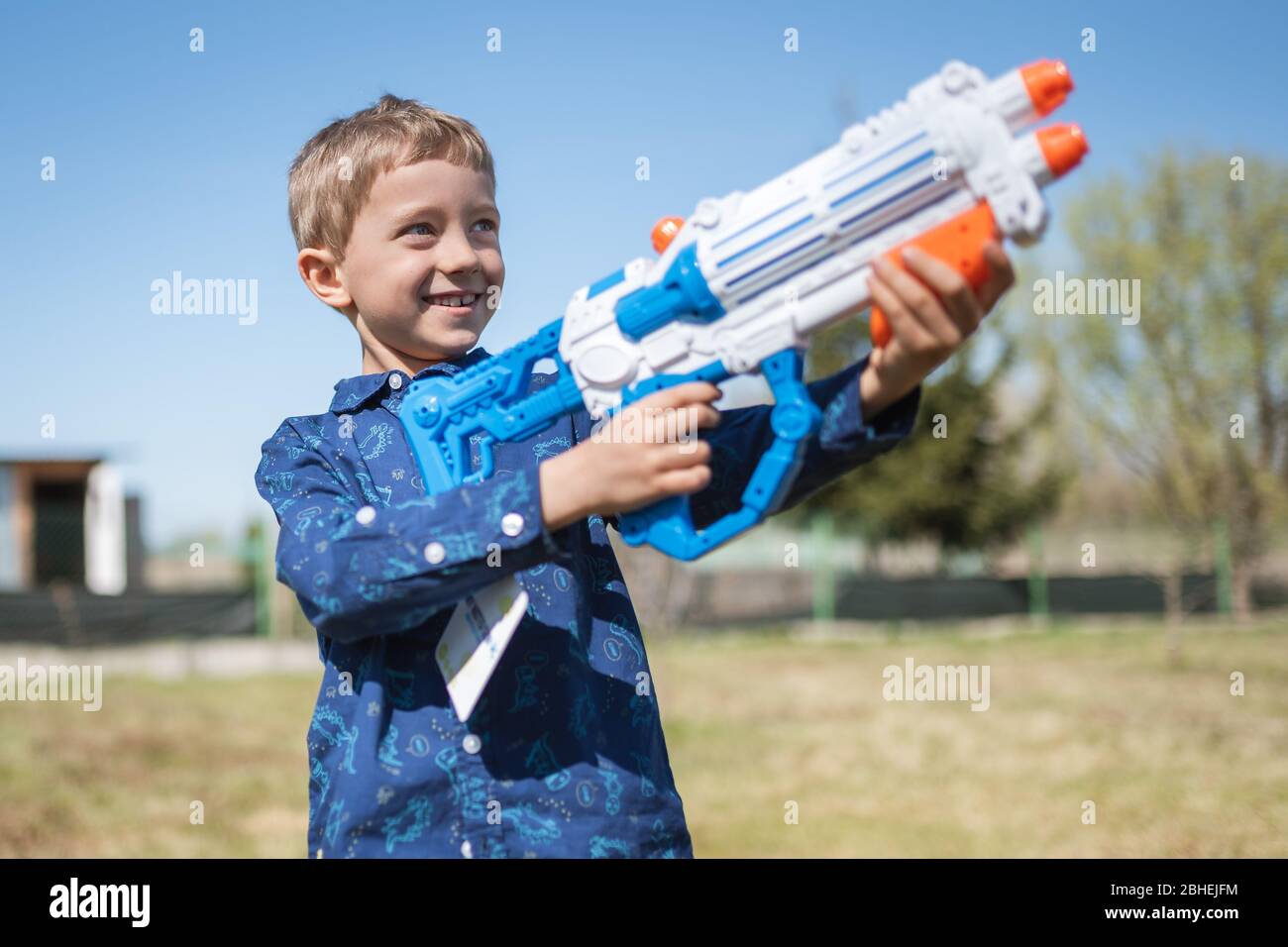 Boy water gun hi-res stock photography and images - Alamy